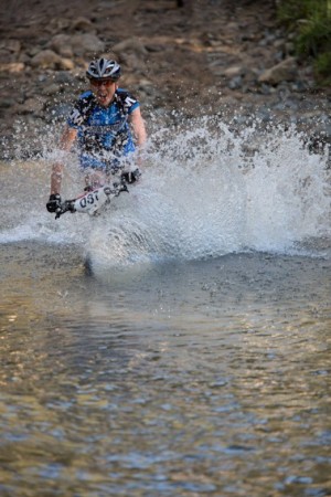 Imogen Smith tackles the river crossing. Photo: Gordon Lamb - Ossyphoto ...