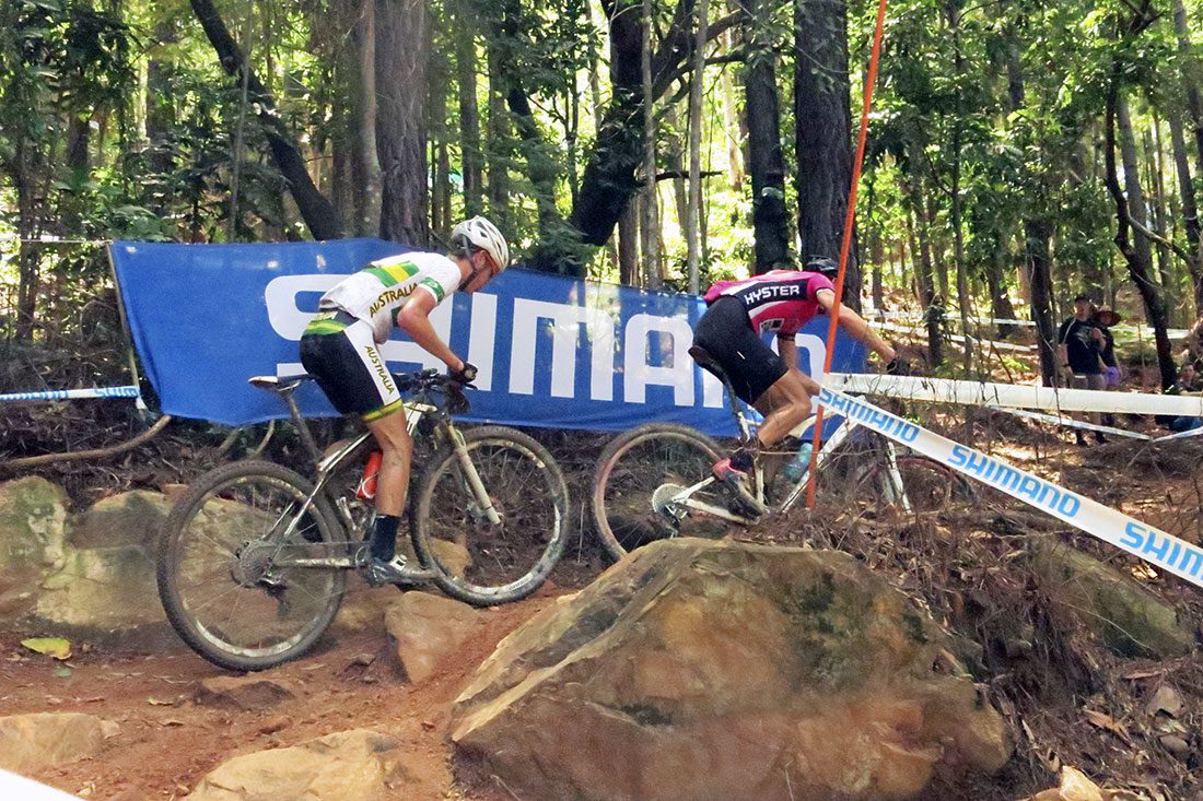 Chris Hamilton and Michael Crosbie climbing through the rocks. Photo ...